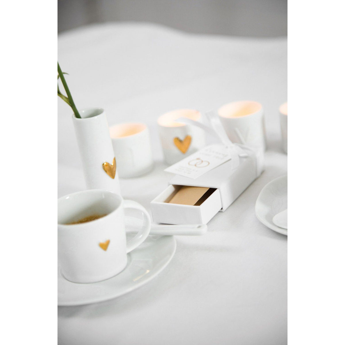 Charming set of two porcelain mini vases featuring gold painted heart ...